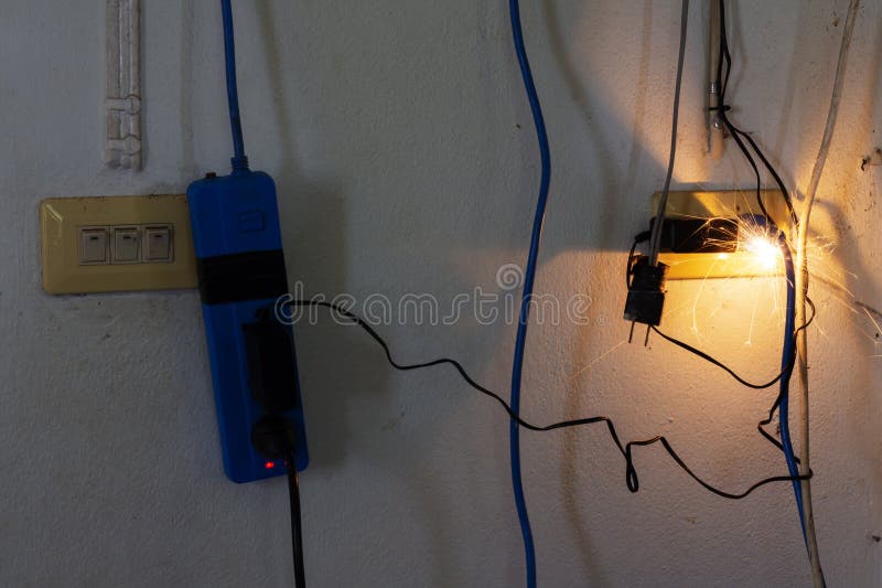 Electrical Plug Sparking and Burning Caused by a Short Circuit, Concept ...