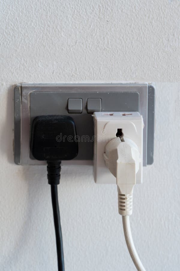 Electrical Plugs Inserted into Wall Sockets Stock Image - Image of ...