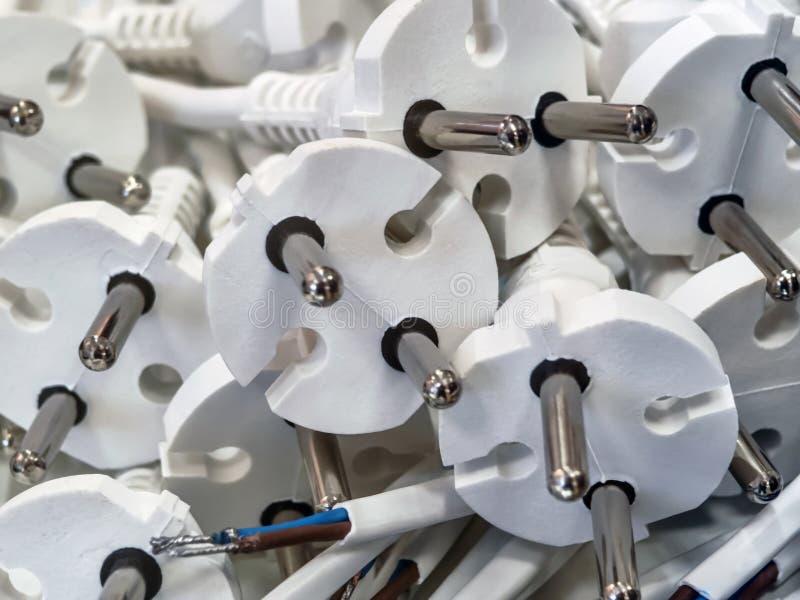 Electrical Plugs Piled Together in a Workshop, Showcasing Different ...