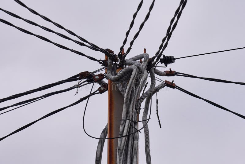 Electrical Pole with Numerous Tangled Cables and Wires. the ...