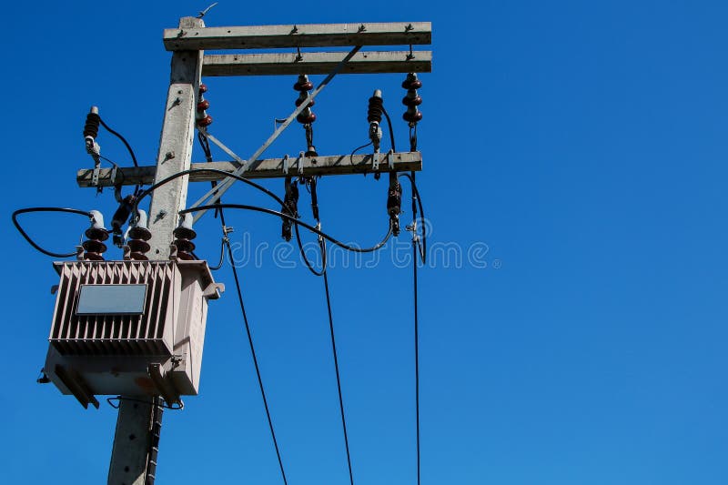Electrical Poles Equipped with Large Power Transformers the Background ...