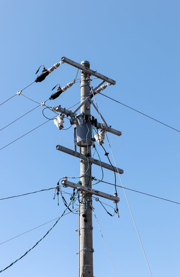 Electrical Post with Power Line Cables., Against Blue Sky Stock Photo ...