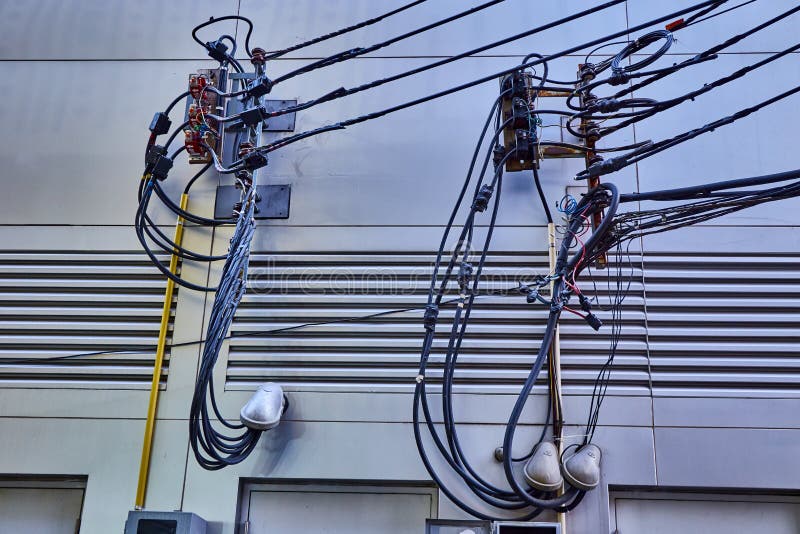Electrical Power Cable On Wall Stock Photo - Image of metal, field ...