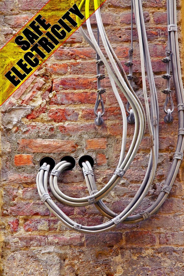 Electrical Power Cables Fixed on a Brick Wall with Protection Junction ...