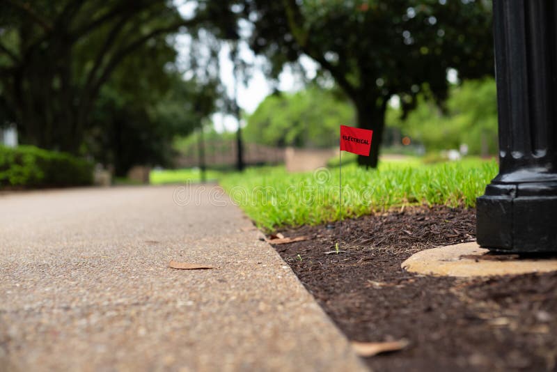 Electrical Power Line Stake Flag beside a Light Post Stock Image ...