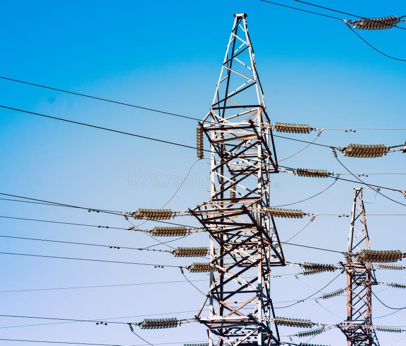 Electrical Power Lines Under a Blue Sky. Tower Stock Photo - Image of ...