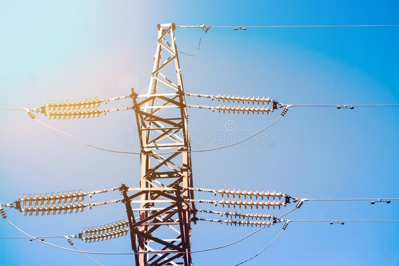 Electrical Power Lines Under a Blue Sky. Tower Stock Image - Image of ...