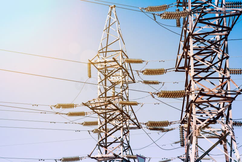 Electrical Power Lines Under a Blue Sky. Tower Stock Image - Image of ...