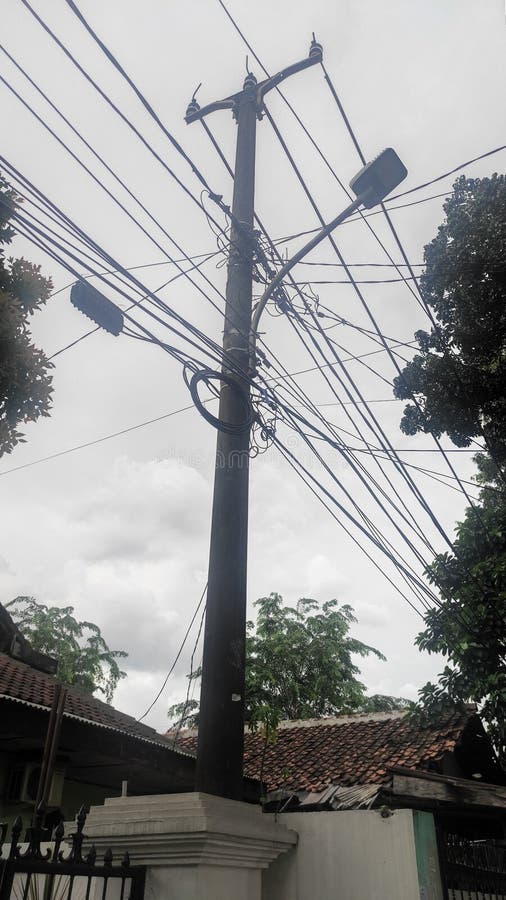 A Pole on the Side of a Building Has a Sign Stock Image - Image of ...