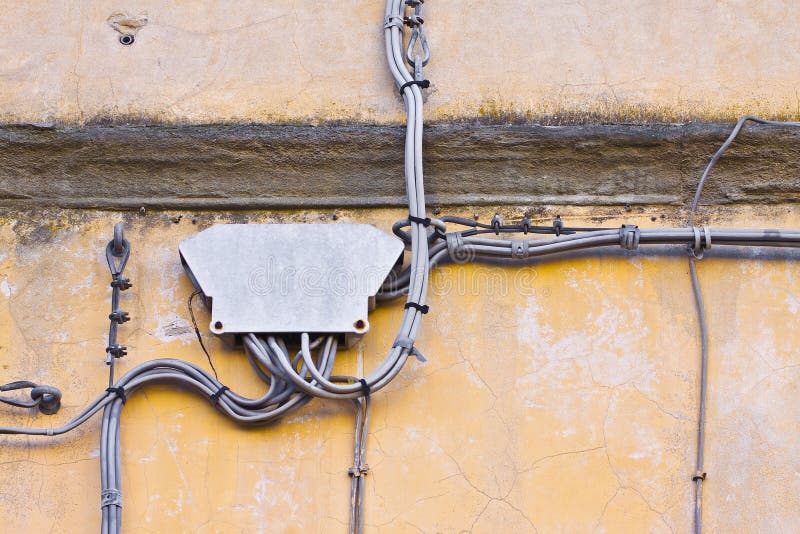 Electrical Power and Telephone Cables Fixwd To a Plaster Wall with ...