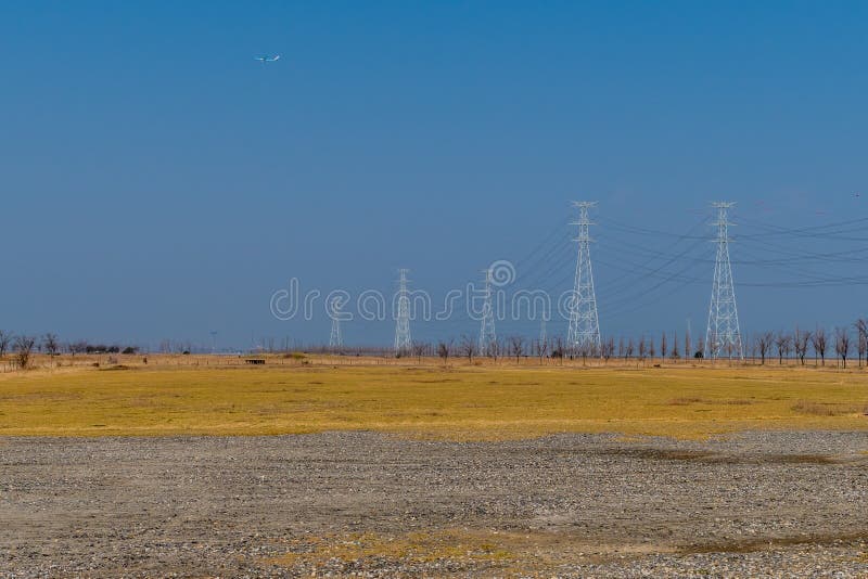 Electrical Power Towers at Edge of Open Field Stock Photo - Image of ...