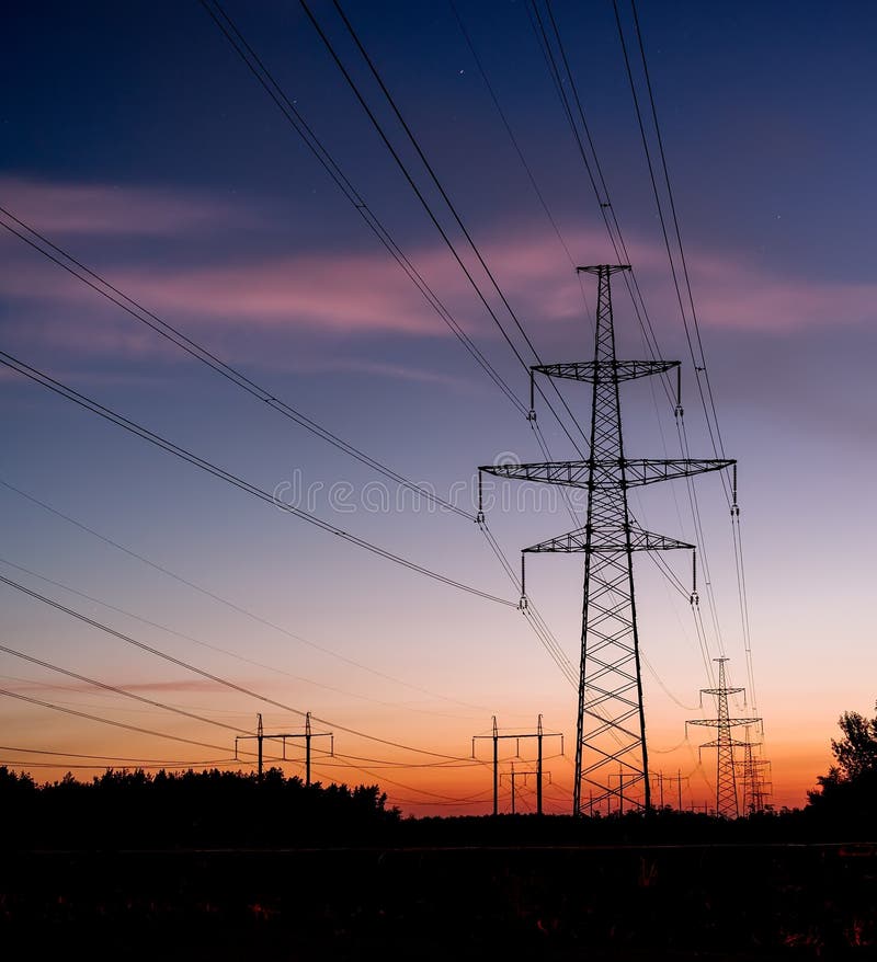 Electrical Pylon And High Voltage Power Lines At Night Stock Photo ...