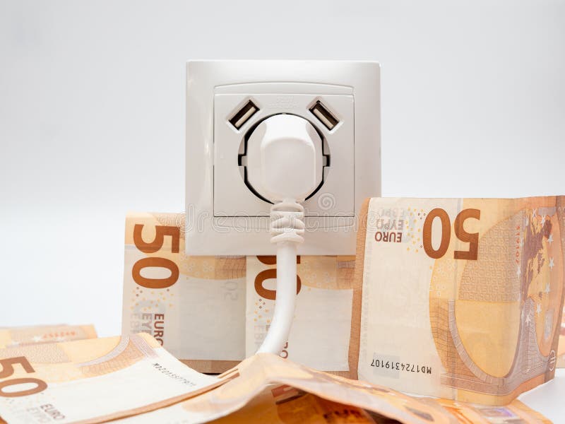 An Electrical Socket with a Connected Plug and Euro Banknotes Around it ...