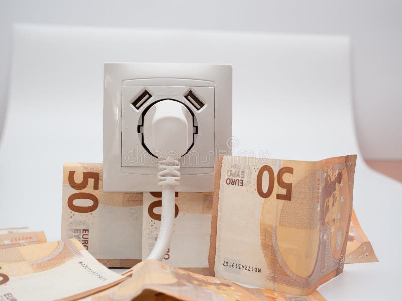 An Electrical Socket with a Connected Plug and Euro Banknotes Around it ...