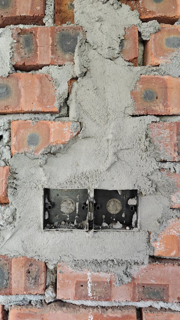 Electrical Socket Hole Mounting Frame on the Brick Concrete Wall Stock ...