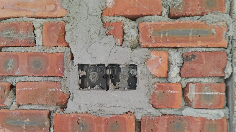 Electrical Socket Hole Mounting Frame on the Brick Concrete Wall Stock ...
