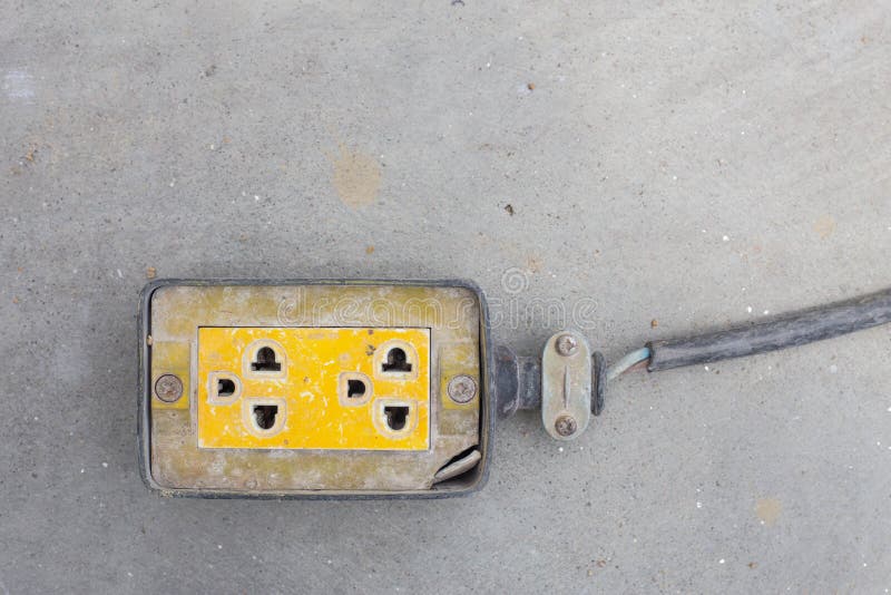 Electrical Socket with Power Plug Cable on Floor for Safety Stock Image ...