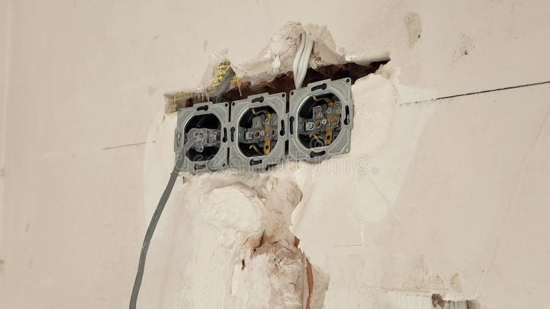 Electrical Sockets on Concrete Wall. Under Construction Electrical ...
