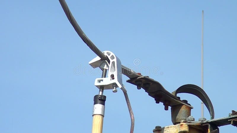 Installation of Insulators on the Mast of a High-voltage Power Line ...