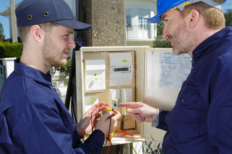 Electrical Technicians Testing Meter in Cabinet Stock Photo - Image of ...
