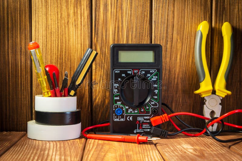 Electric Tester and Electronics Tool Kit on Wooden Background Stock ...