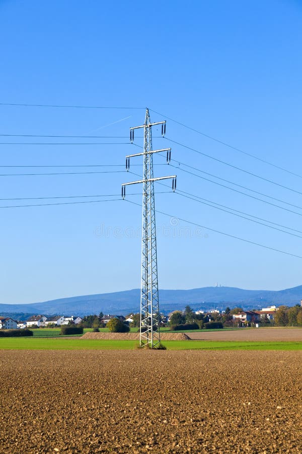 Electrical tower in field stock photo. Image of grass - 58325402