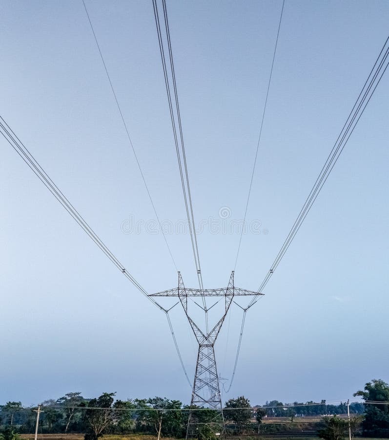 Electrical Tower Under Blue Sky. Towering Electrical Tower with Vast ...