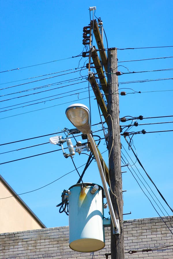 Electrical Transformer Attached To the Electric Post with Electric ...