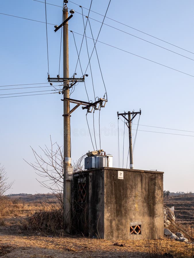 Rural Electrical Transformer on Concrete Base with Power Lines Stock ...