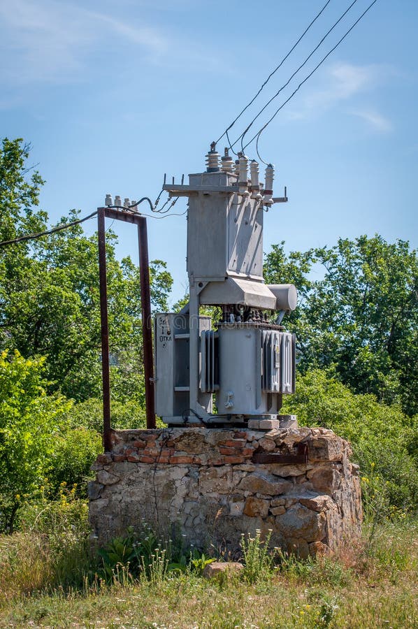 Electrical Transformer on a Stone Stand. Old High-voltage Power Station ...