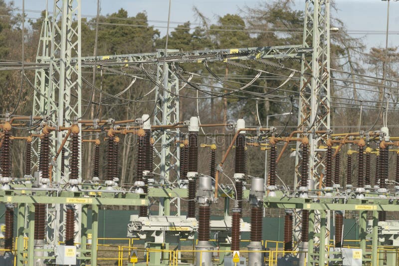 Electrical Transformers in a Power Station with Trees Behind Stock ...