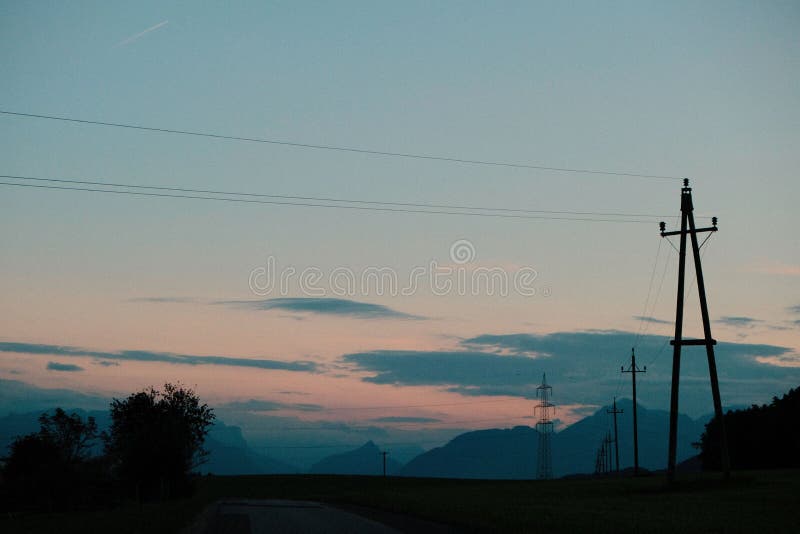 Electrical Utility Poles Against a Sunset Stock Photo - Image of supply ...