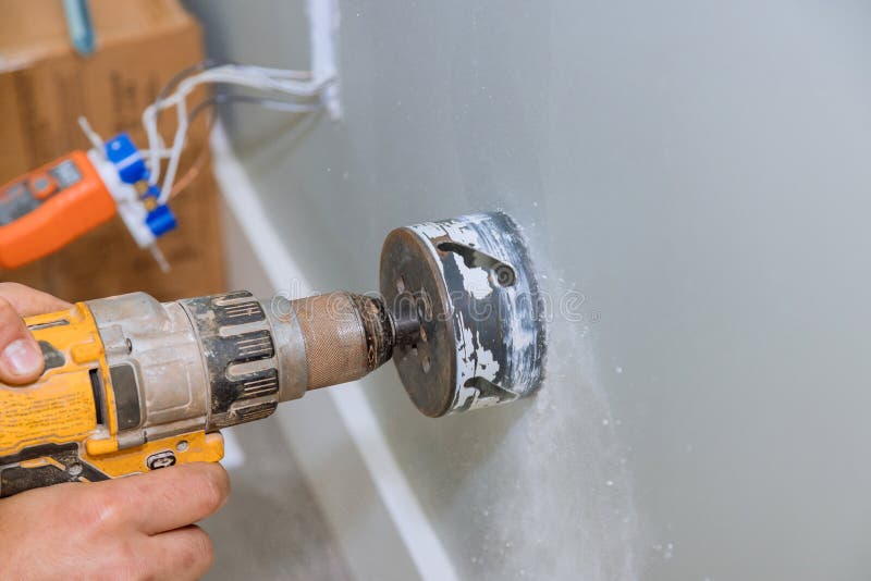An Electrical Wire Has To Be Installed in the Wall by Drilling a Hole ...