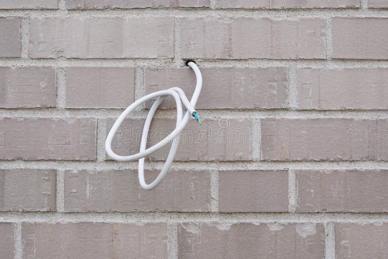 Electrical Wire or Power Cable Hanging from Exterior Wall Stock Photo ...