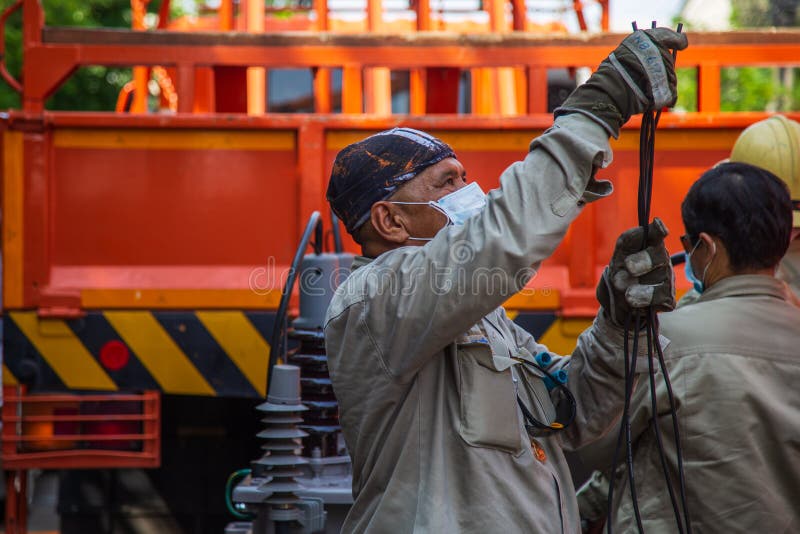 Electrical Wireman are Preparing Cable before Install Cable To the ...