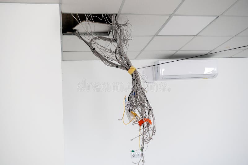 Electrical Wires Hanging from the Ceiling. Cables Hanging from Ceiling ...