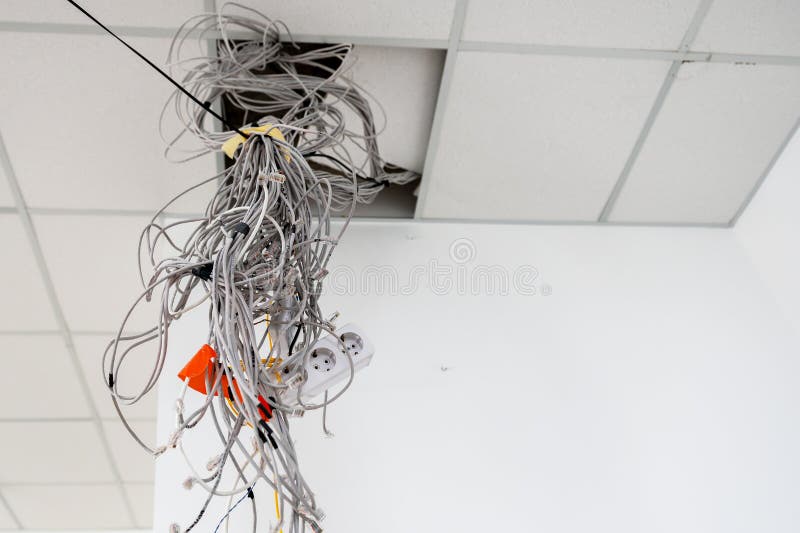 Electrical Wires Hanging from the Ceiling. Cables Hanging from Ceiling ...