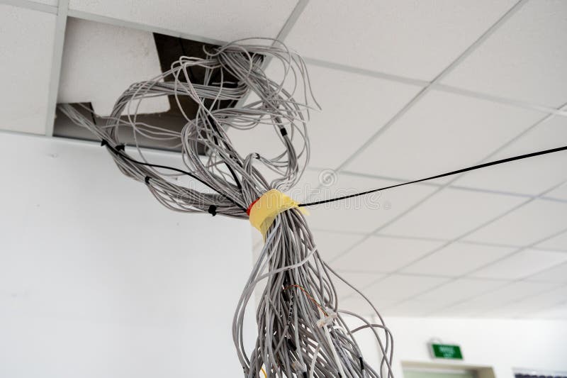 Electrical Wires Hanging from the Ceiling. Cables Hanging from Ceiling ...