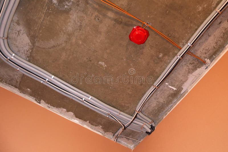 Electrical Wires in a Protective Corrugated Pipe and Fire Detectors are ...