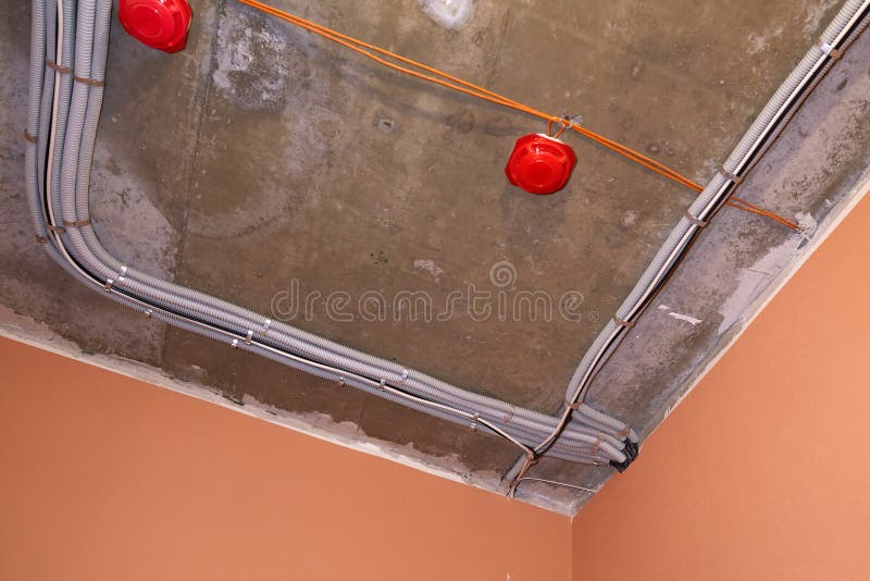Electrical Wires in a Protective Corrugated Pipe and Fire Detectors are ...