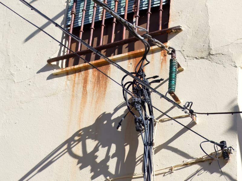Electrical Wires and Rusty Window Bars Casting Shadows on a White Wall ...