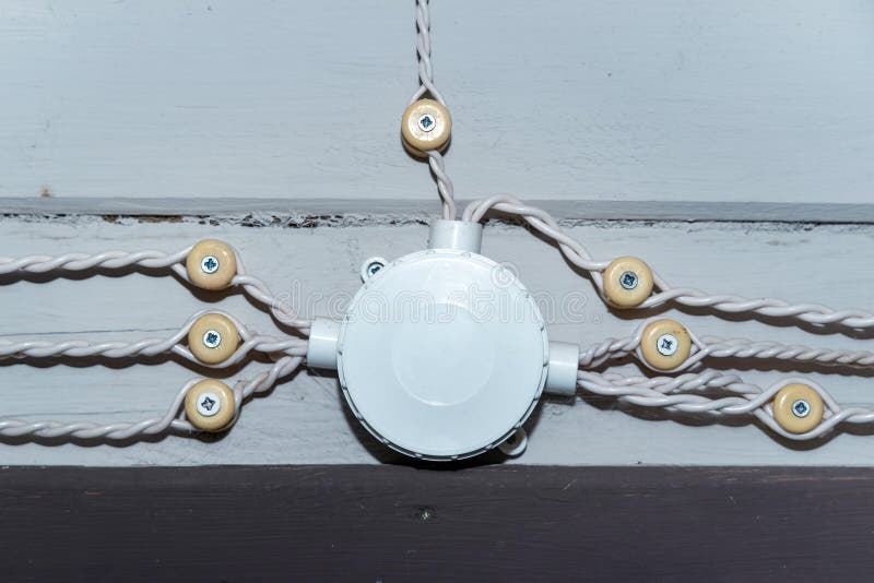 Electrical Wiring Made of White Cables on Top of a Wooden Beam Stock ...