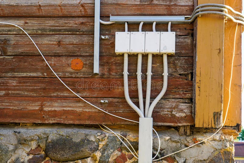 Electrical Wiring on the Outer Wall of an Old Wooden House Stock Photo ...