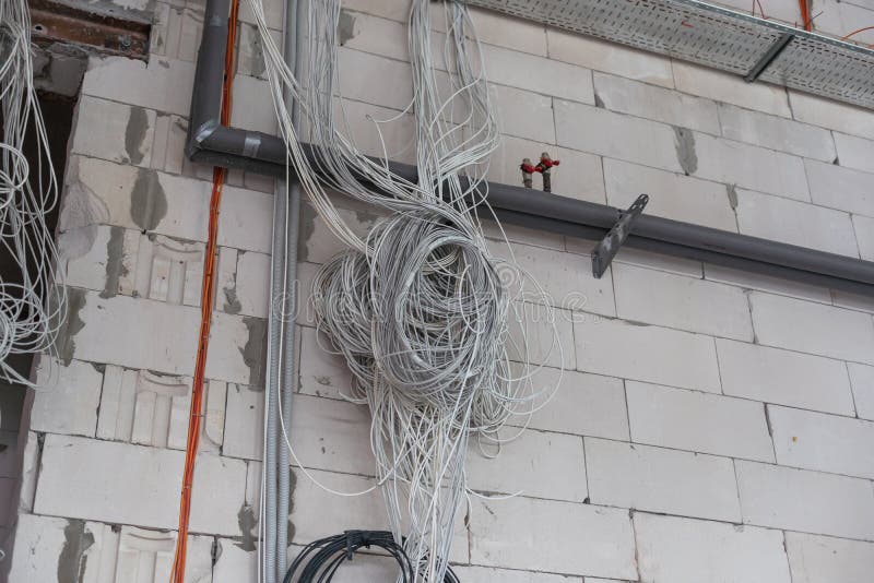 Electrical Wiring Work at a Construction Site. Wire Extension. Stock ...