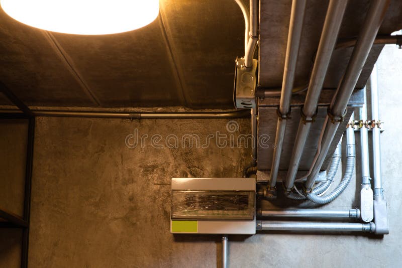 Electrical Wiring Work in a Steel Pipe of a House with a Loft Style ...