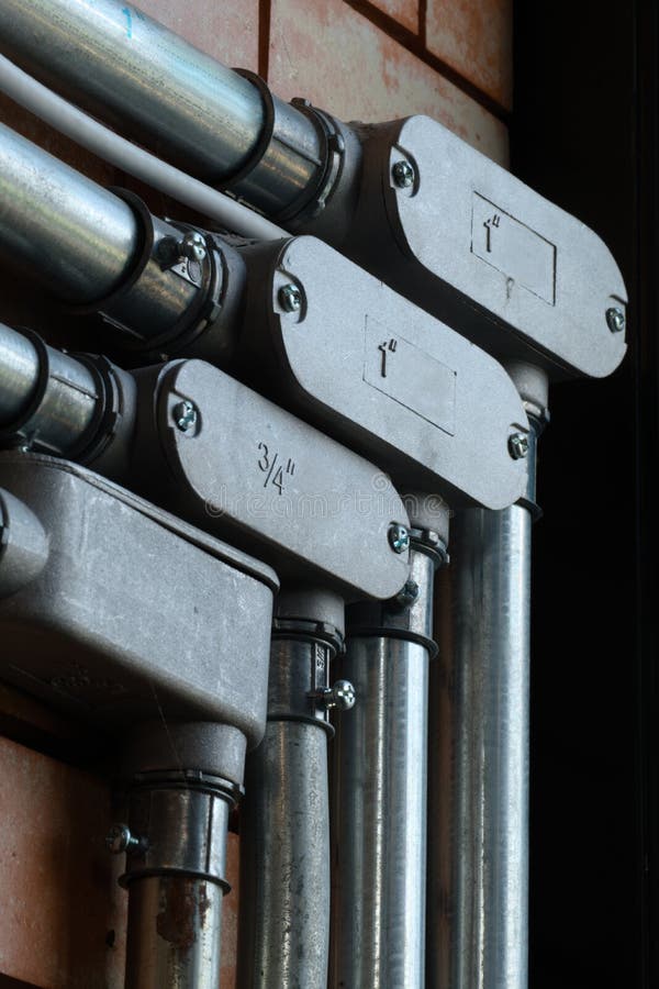 Electrical Wiring Work in a Steel Pipe of a House with a Loft Style ...