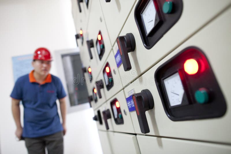 Electrical Worker Surveillance the Electricity Dial in the Control Room ...