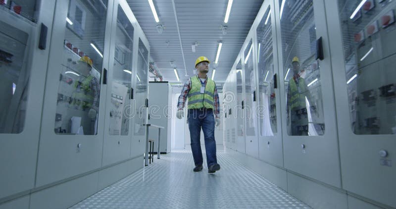 Electrical Worker Walking Down the Hall Stock Video - Video of ...