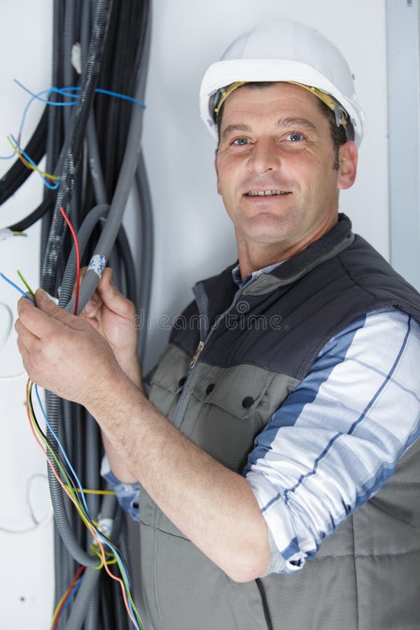 Electrical Worker Wiring in Modern Building Stock Image - Image of ...