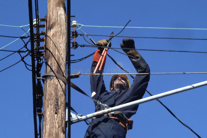 Electrical Worker Working on Electrical Lines on the Pole Editorial ...